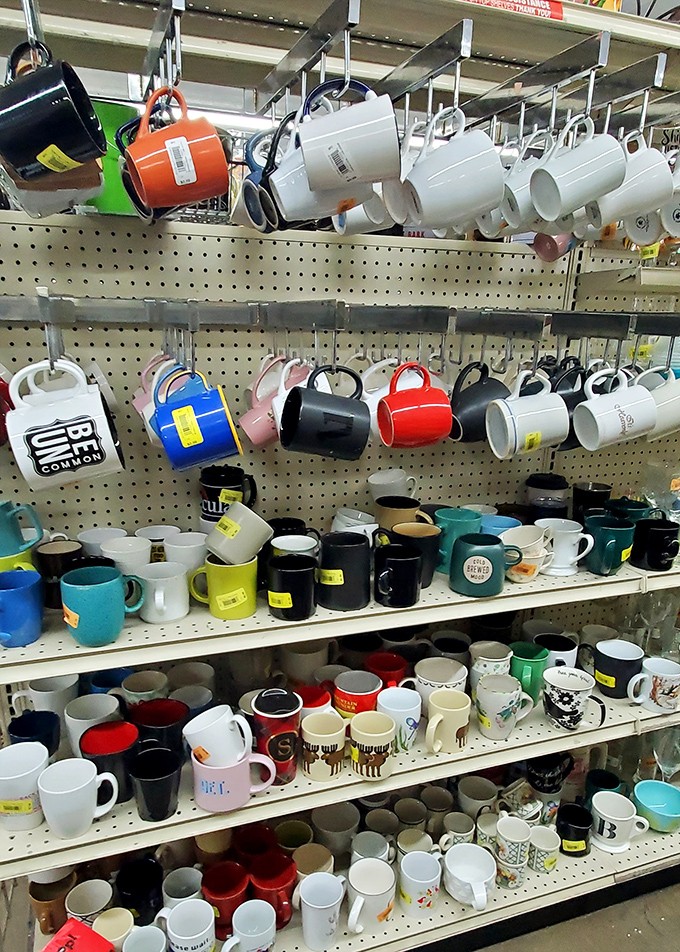 The mug wall &ndash; where coffee vessels of personalities past await their chance to hold your morning brew.
