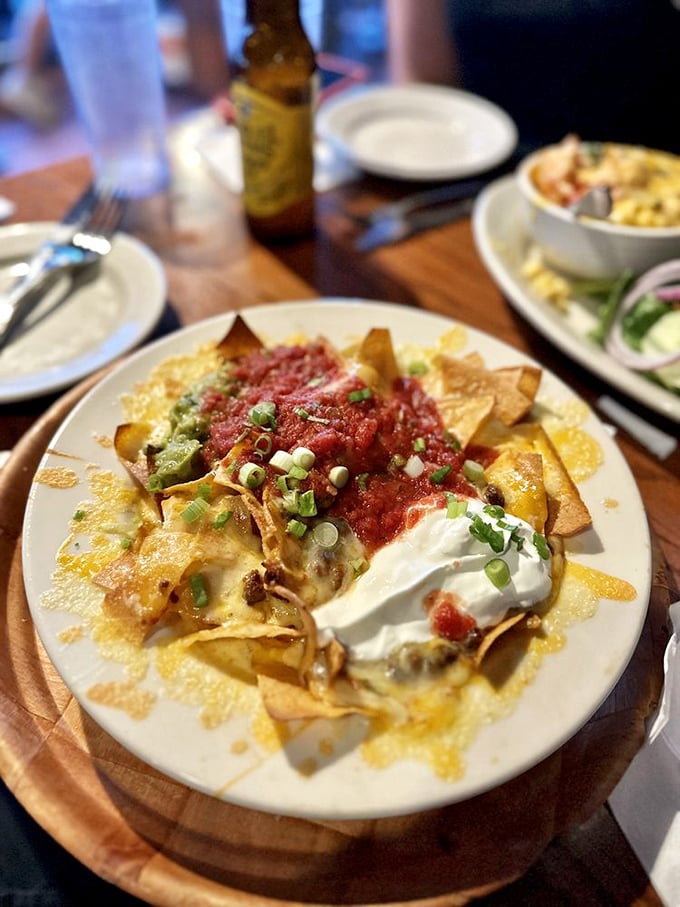 These nachos have clearly been living their best life, smothered in melty cheese and fresh toppings that would make any happy hour happier.