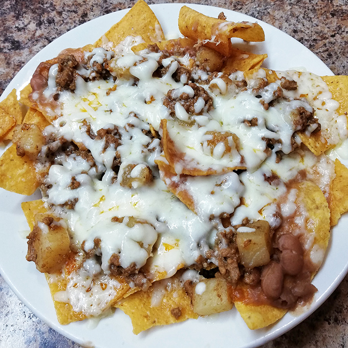 Nachos that laugh in the face of stadium versions &ndash; these loaded beauties ensure every chip gets its fair share of the melty, meaty goodness.