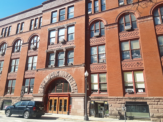 The National Transit Building's distinctive red brick and arched entrance speak to an era when oil barons built with permanence and pride in mind.