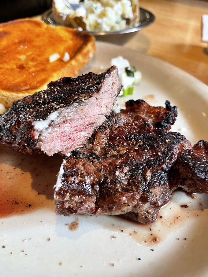 This New York strip, sliced to reveal its perfect medium-rare interior, is what beef dreams are made of. The toast and potato complete the holy trinity.