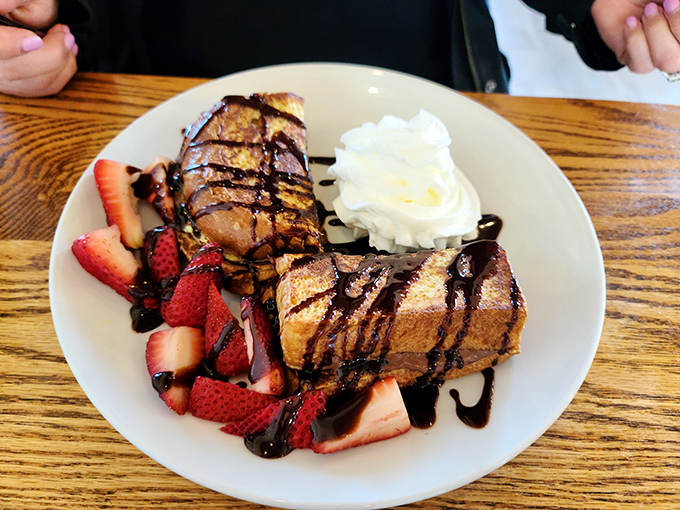 Nutella French toast drizzled with chocolate and surrounded by fresh strawberries&mdash;dessert masquerading as breakfast, and we're not complaining.