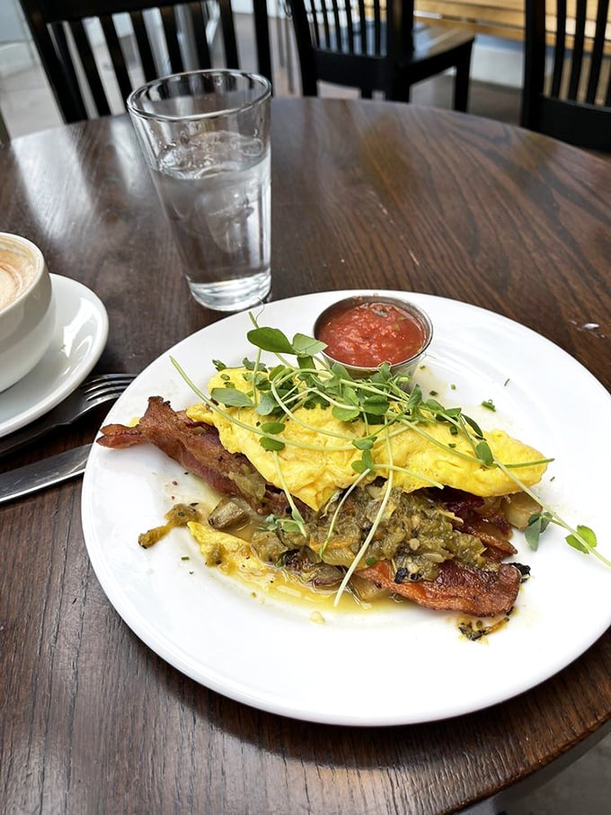 This isn't just an omelet&mdash;it's a morning masterpiece with perfectly folded eggs, crispy bacon, and microgreens that actually contribute flavor.