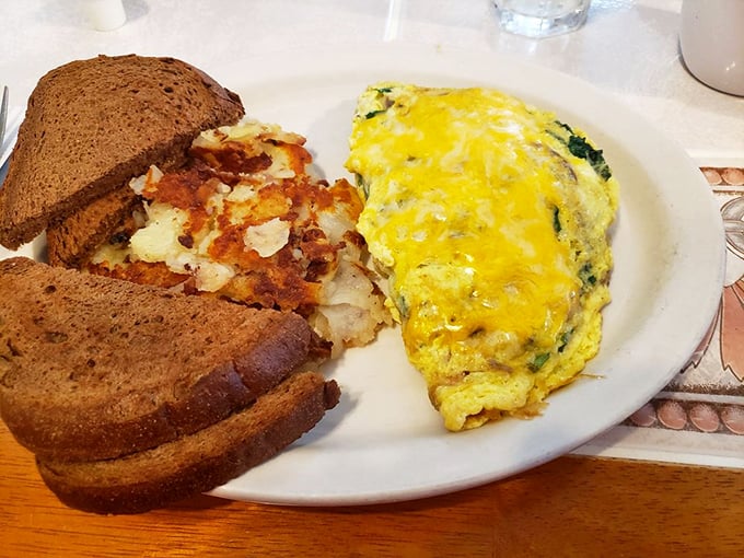 This isn't just an omelet&mdash;it's a perfectly executed morning masterpiece with cheese melted just right and home fries that deserve their own fan club.