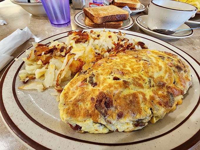 The perfect omelet doesn't exi&mdash; Oh wait, there it is, golden and puffy, lounging next to hash browns that have achieved the ideal crisp-to-tender ratio.