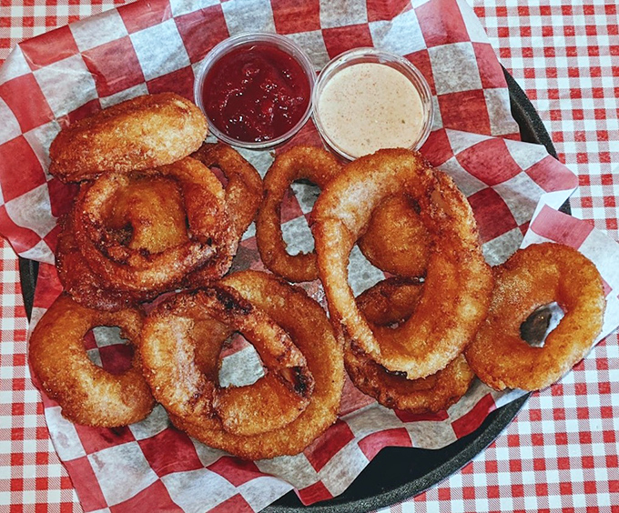 Golden, crispy onion rings that crunch like autumn leaves, served with dipping sauces that make you question why you'd ever eat vegetables any other way.