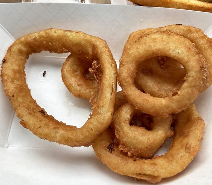 Onion rings with that perfect crunch-to-squish ratio - the kind that make you involuntarily close your eyes with each bite.