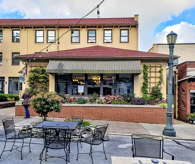 Outdoor dining where flowers compete with food for your attention. The brick planters have probably heard every vacation story imaginable.