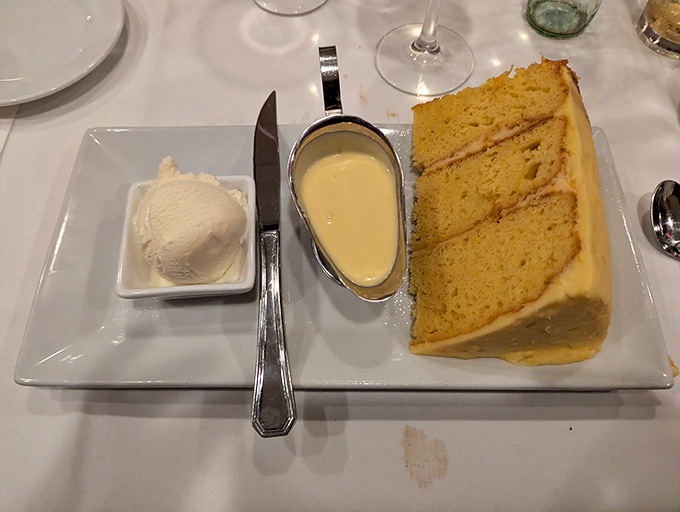 A slice of cake that doesn't need birthday candles to be celebratory. Three layers of "yes, please" with a side of vanilla ice cream for good measure.