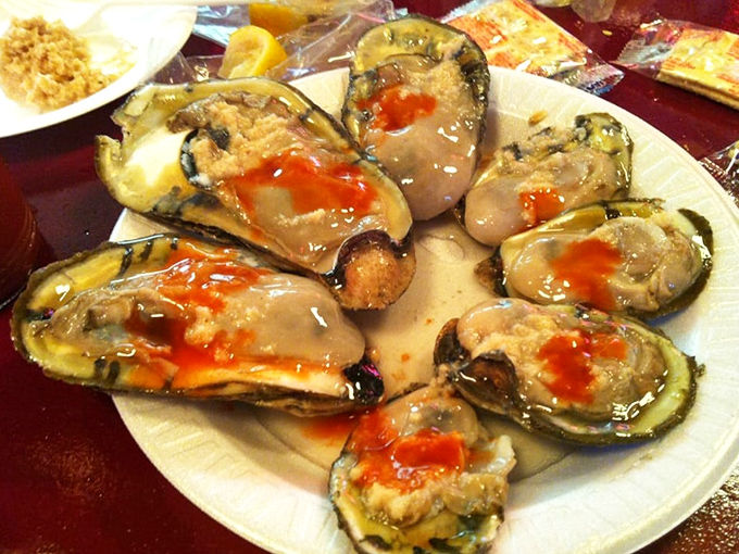 Fresh oysters glisten like pearls from Neptune's treasure chest, waiting for their moment to shine.