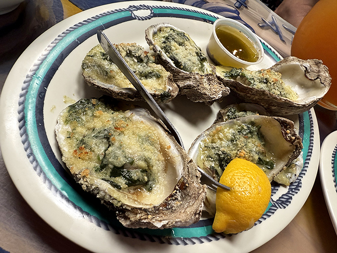 Oysters Rockefeller dressed in their finest herbs and cheese, proving that even bivalves can be fancy when properly attired.