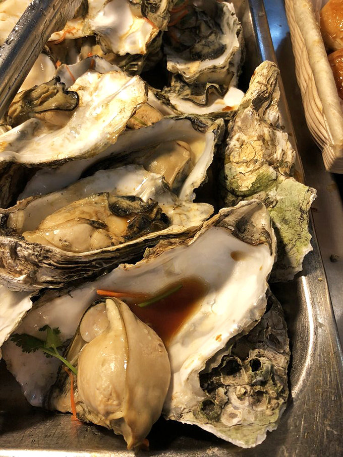 Oysters lounging in their shells like they're at a spa day, waiting for their moment to shine.