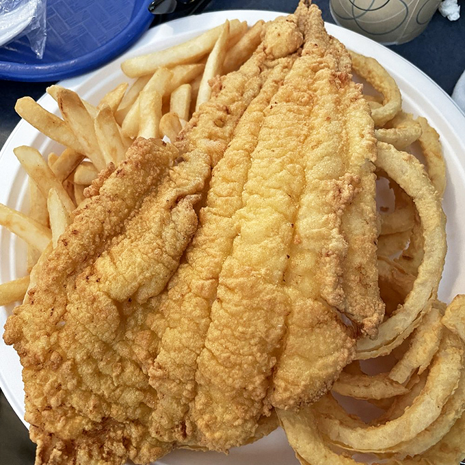 Perfectly golden haddock that makes you understand why people willingly stand in line. The fish practically high-fives your taste buds.