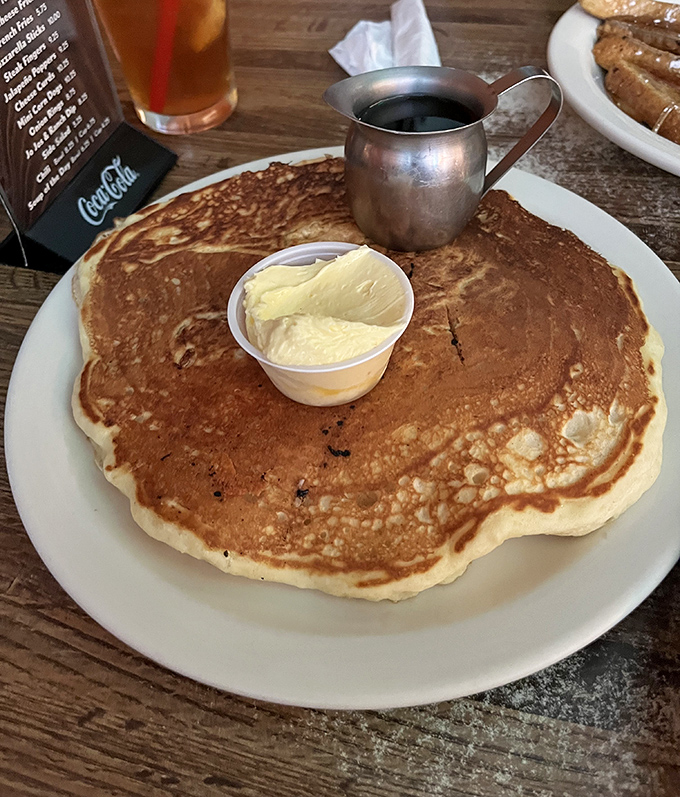 Pancakes the size of hubcaps with butter melting into every nook and cranny. The small metal pitcher of syrup is just begging to create a sticky masterpiece. 