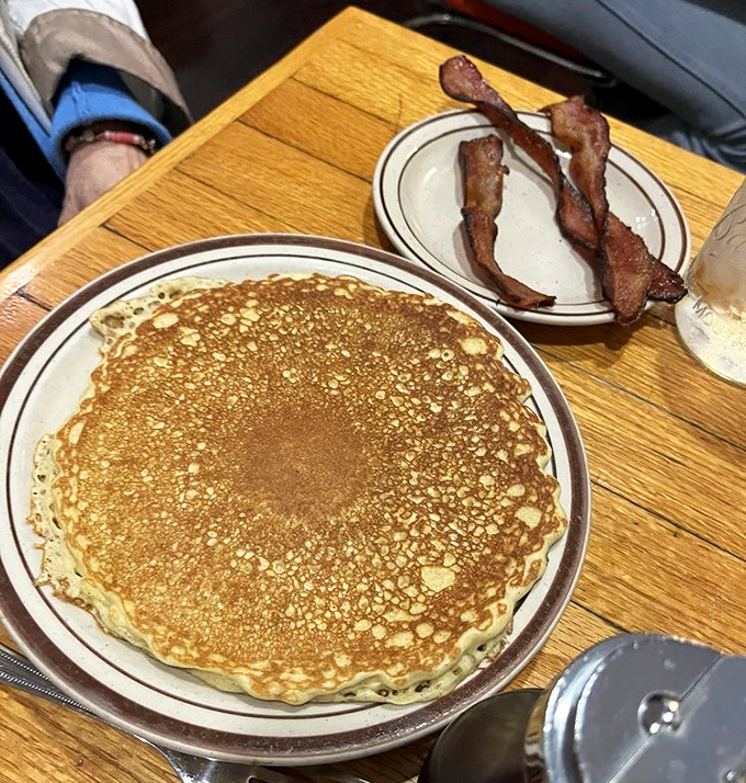 The perfect pancake doesn't exi&mdash; Oh wait, there it is, golden as a Midwest sunset, with bacon standing guard against healthy eating intentions.