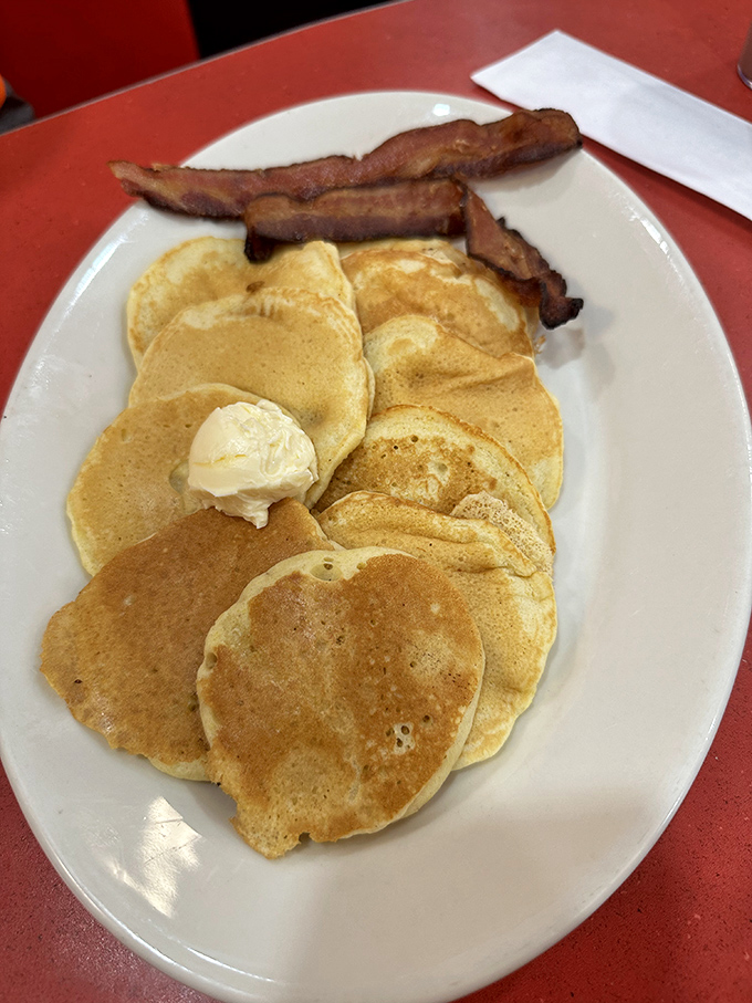 Pancakes so golden and fluffy they make you want to cancel all appointments for the day. Add that pat of butter and crispy bacon, and you've found breakfast nirvana.
