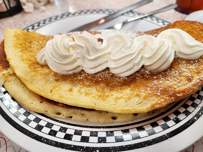 These pancakes don't just hang off the plate&mdash;they practically need their own zip code and deserve every inch of real estate.