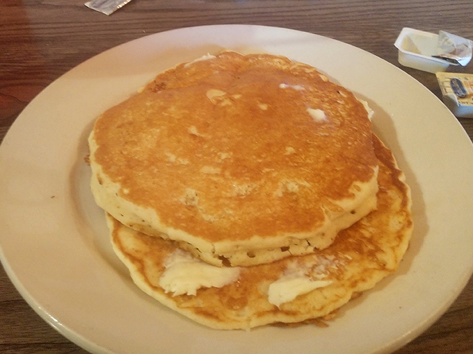 Golden pancakes stacked like edible gold coins&mdash;simple perfection that makes you question why anyone needs fancy breakfast foods.