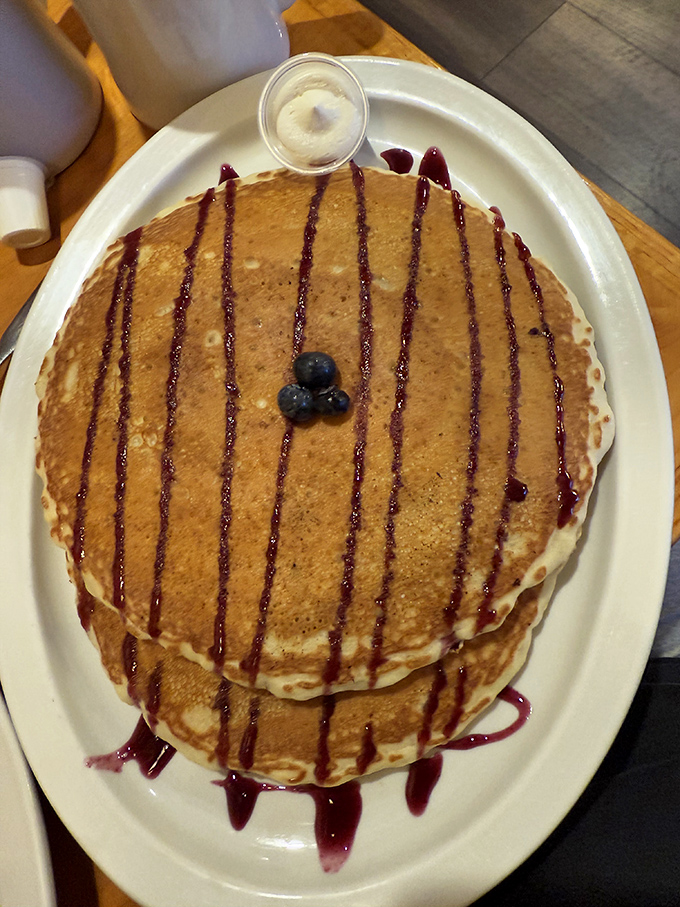 Pancakes drizzled with berry syrup and topped with blueberries&mdash;the breakfast equivalent of hitting the lottery on a Monday morning.