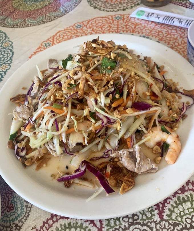 This papaya salad doesn't mess around &ndash; a crunchy, tangy celebration that makes your taste buds feel like they're at Mardi Gras.