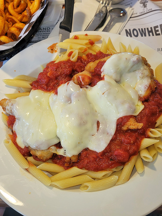 Chicken parmesan that doesn't mess around. When pasta meets marinara meets melted cheese, everybody wins at this comfort food lottery.