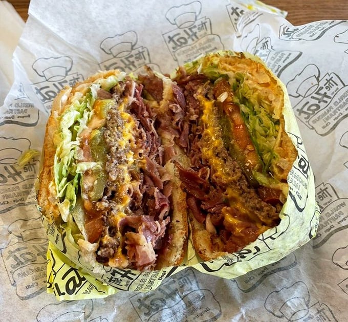 When you can't decide between a burger and pastrami, The Hat says, "Why choose?" This beautiful marriage of classics deserves its own holiday.