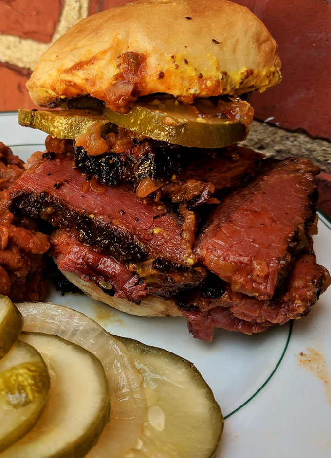 This isn't just a sandwich&mdash;it's architecture. Layers of pastrami and pickles create a skyscraper of flavor that would make any New York deli jealous.