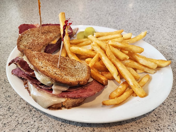 A proper deli sandwich stacked higher than your weekend to-do list. That pastrami looks like it took a proper nap in the smoker.
