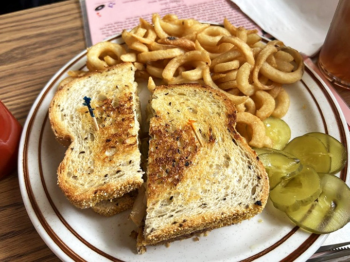 The patty melt: where bread meets beef in a marriage officiated by grilled onions and sealed with a kiss of American cheese.