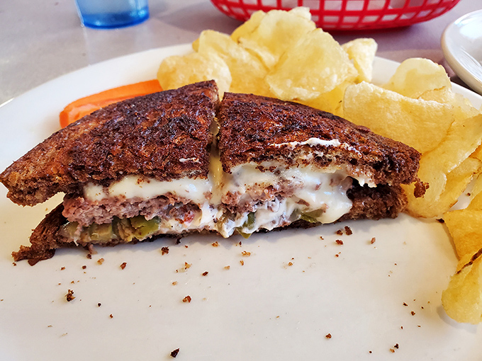 The patty melt achieves that perfect balance of crispy bread, melted cheese, and seasoned beef that defines diner excellence.