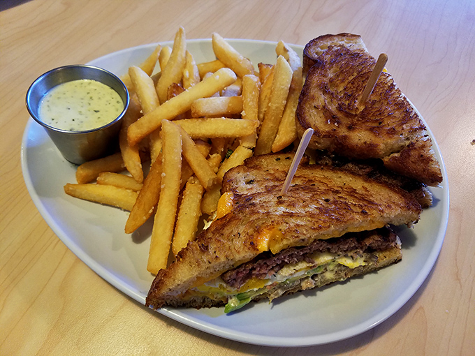The patty melt&mdash;where burger meets grilled cheese in a harmonious union that makes you wonder why they ever lived apart.