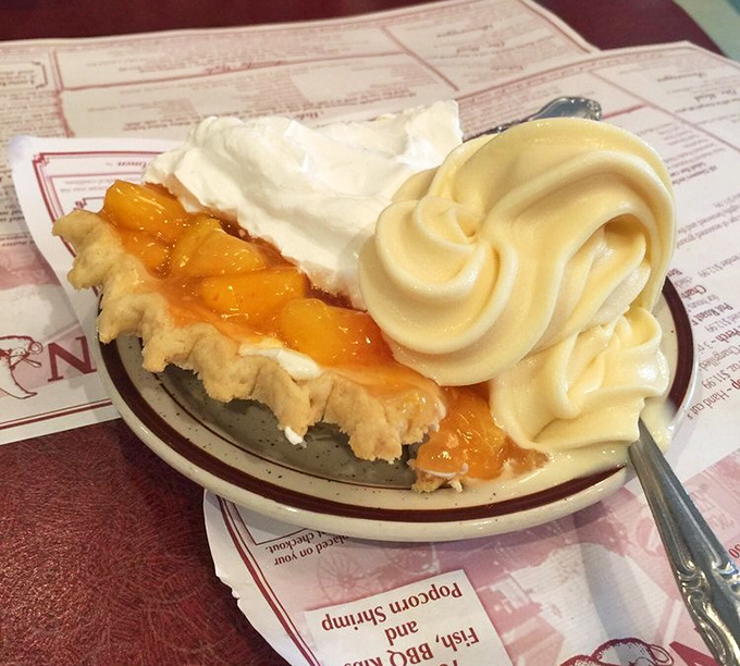 This peach pie with its gravity-defying cream topping is what dessert dreams are made of.