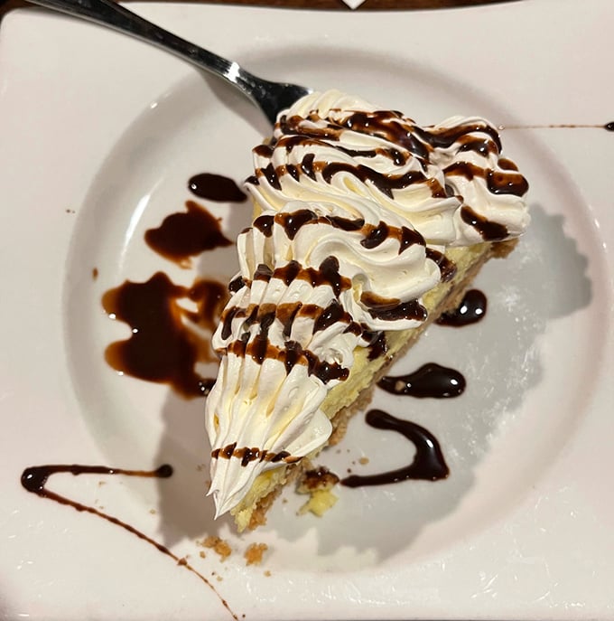 This slice of cream pie isn't just dessert; it's the sweet finale to a seafood symphony that deserves its own standing ovation.