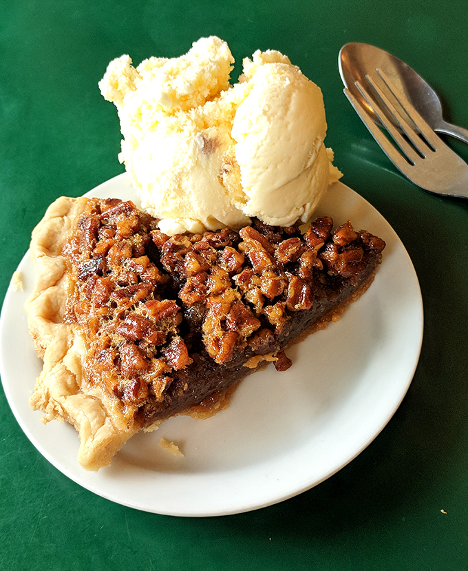 Pecan pie that strikes the perfect balance between gooey and crunchy, sweet and nutty. That scoop of vanilla ice cream isn't optional&mdash;it's completing a sacred ritual.