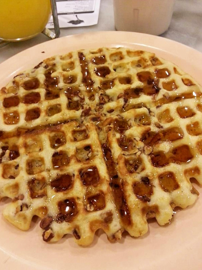 Behold the pecan waffle in its natural habitat&mdash;golden, crisp, and absolutely swimming in syrup, like breakfast wearing its Sunday best.