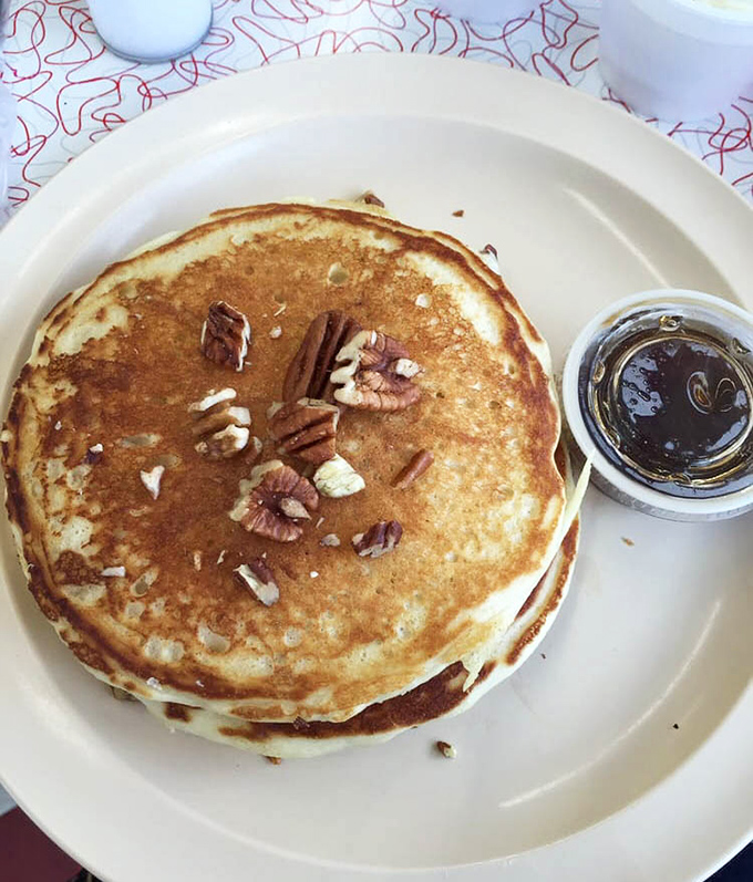 Pecan pancakes that look like they were made by someone who truly understands the meaning of breakfast. Those nuts aren't decoration&mdash;they're commitment.