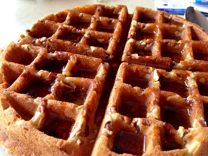 The pecan waffle—a geometric wonder with perfect squares designed by breakfast engineers to hold maximum syrup in every delicious pocket.