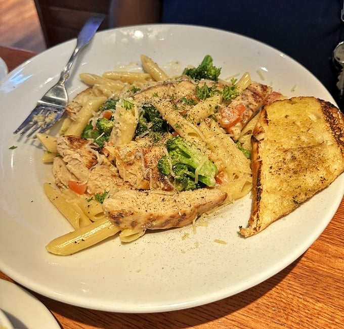 Pasta that doesn't know it's in a sports bar. The broccoli is there to make you feel virtuous about the generous portion of creamy sauce.