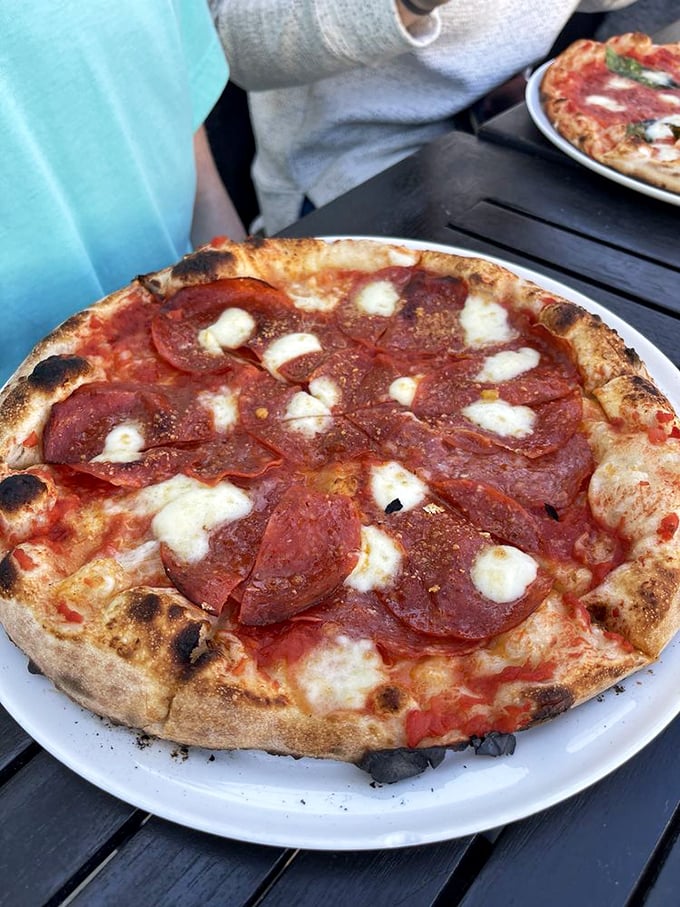 Pepperoni that curls into little cups of savory perfection, each one collecting precious flavor-packed oils like tiny culinary treasures.