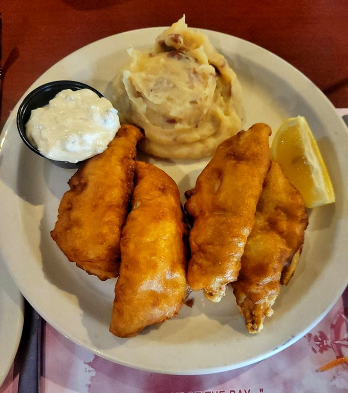Golden-battered perch that shatters with each bite, paired with mashed potatoes that clearly didn't come from a box. Lake Erie's finest.
