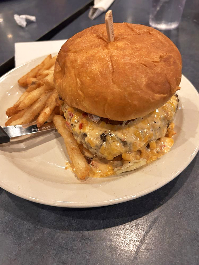 This isn't just a burger&mdash;it's a towering achievement of beef, cheese, and bun engineering that requires both hands and several napkins.