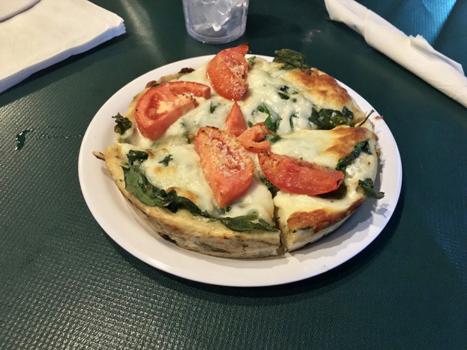 The Pizza Villa Special showcases what happens when simple ingredients meet decades of pizza-making wisdom &ndash; a slice of DeKalb heritage.