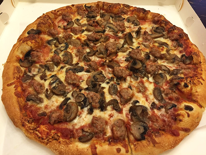 A pizza that doesn't need filters or fancy toppings&mdash;just perfectly balanced mushrooms, sausage, and cheese melted into harmonious bliss.