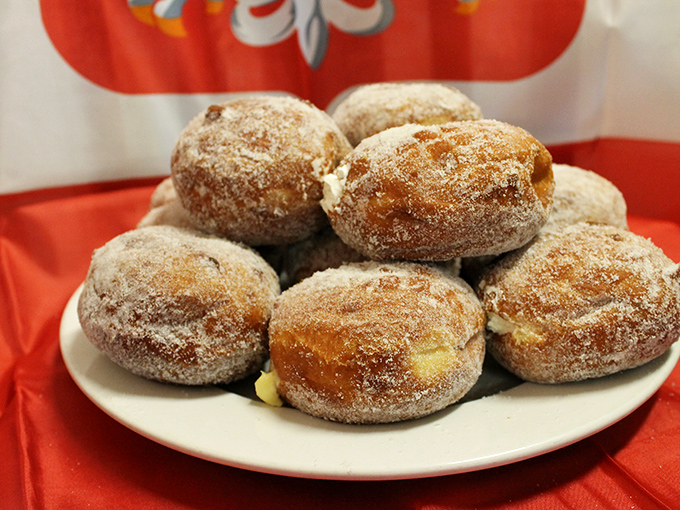 Sugar-dusted pączki that could start a religious experience. These Polish donuts aren't just dessert—they're the reason elastic waistbands were invented.