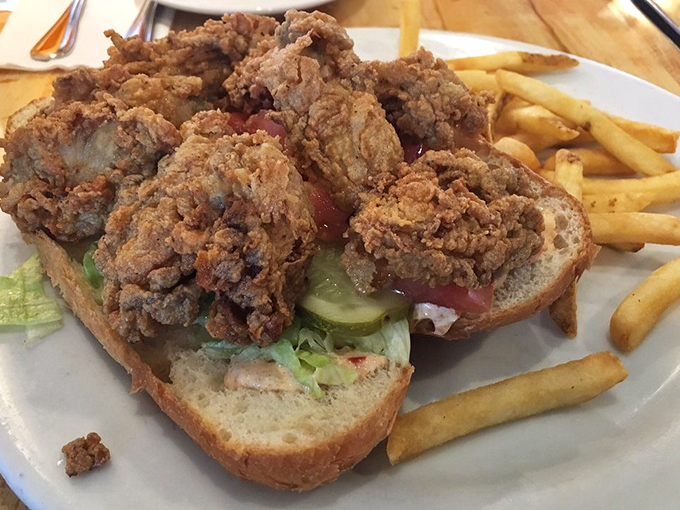 A po' boy that's anything but poor in flavor&mdash;fried oysters spilling over the edges of fresh bread with just enough greenery for color.