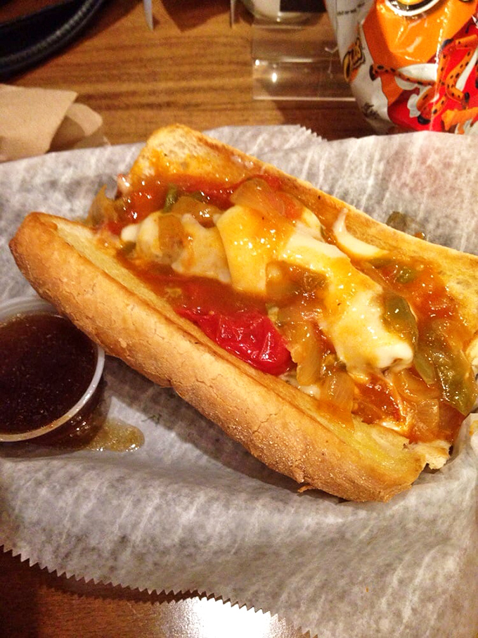 The hand applying that final touch of celery salt &ndash; the culinary equivalent of a painter signing a masterpiece. Chicago dog perfection!
