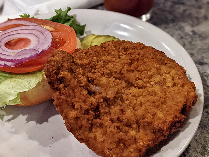That breaded pork tenderloin is bigger than the bun, which is exactly how life should work sometimes, honestly.