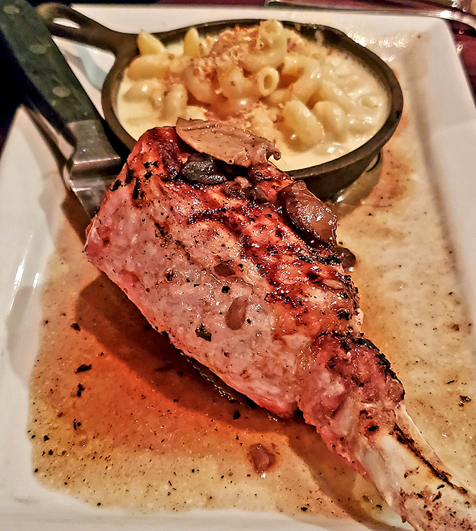 This pork chop isn't just dinner&mdash;it's architecture, sculpture, and comfort food all on one plate, with mac and cheese playing the perfect supporting role.