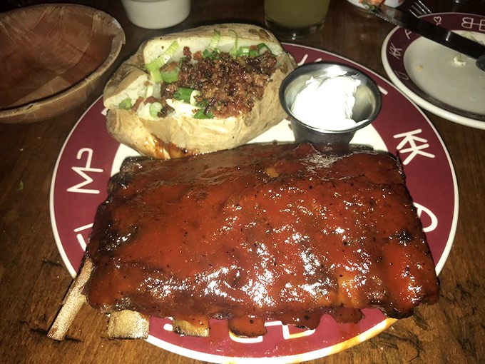 These ribs don't just fall off the bone – they practically leap onto your fork, glazed in a sauce worth licking your fingers for.