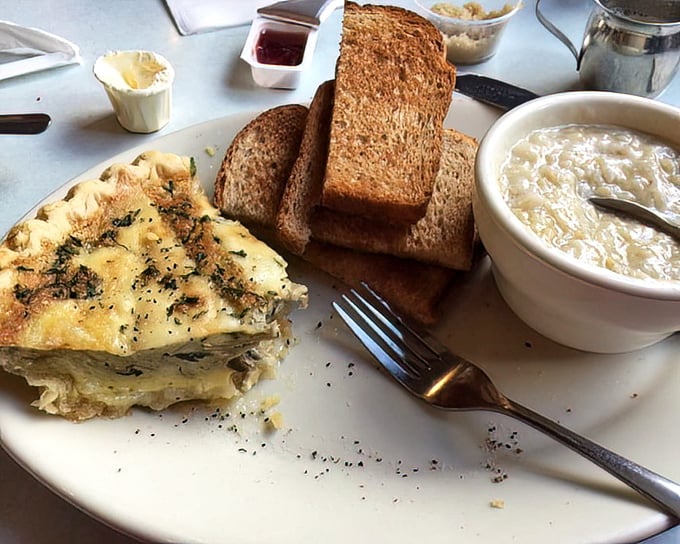 This isn't just breakfast&mdash;it's architecture. Layers of egg, herbs, and cheese alongside grits that would make any Southerner nod in approval.